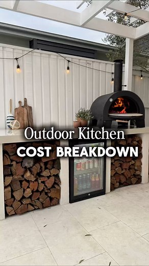 OUTDOOR KITCHEN COST BREAKDOWN 💸✨ Here’s exactly what we spent building our DIY outdoor kitchen so you can plan your own backyard upgrade: • Timber Frame: $150 from @bunker.queensland • Cement Sheeting: $150 from @bunnings • Sealer: $44 @dunloptradeau • Tiles: leftover from our house • Adhesive: $32 • Grout: $16 • Render $182 • Pizza Oven Refresh: $32 from @whiteknightpaints • Firewood: $350 • Festoon Lights: $120 @amazonaustralia • Total: $1076 This whole space was a mix of DIY, budget-friendl