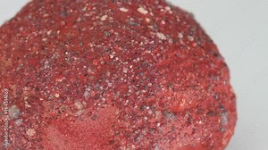 Cinnabar or cinnabarite, red mineral stone from Mercury sulfide, isolated on a white background