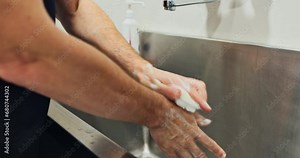 Doctor, washing hands and soap by scrub for surgery for operation, hygiene and disease. Person, surgeon and closeup for preparation, clean or protection in medicine for healthcare, hospital or clinic