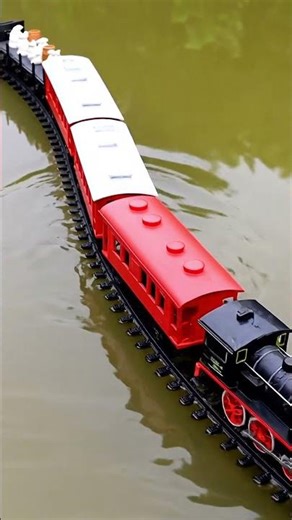 A Toy Train Riding on Floating Tracks in a Muddy River
