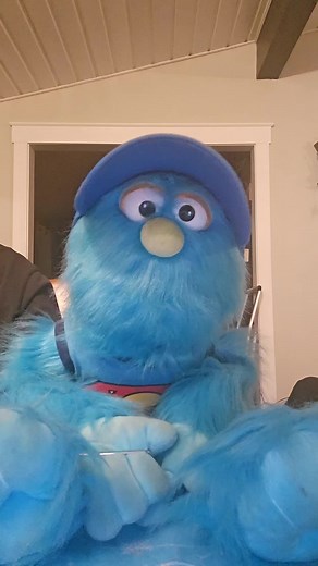 Funny Blue Puppet Engages in Cozy Conversation