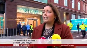 Crowd control measures were used in Belfast City Centre to cope with the number of people wanting to get into the new Primark on Castle Street this morning. The four-storey outlet is behind the Bank Buildings store which was destroyed by fire in August. As Mark Simpson reports, more than a thousand people were waiting outside when the new premises opened. | BBC Newsline