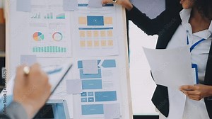 Team of Creative Web Graphic Designer planning, drawing website ux app for mobile phone application and development template layout, process to developing prototype wireframe, User experience concept.