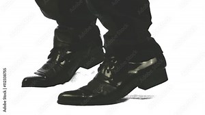 closeup of the walking legs in black shoes, experiencing people. The white background to evaluate the picture, green for ease of separation of the object from the background.