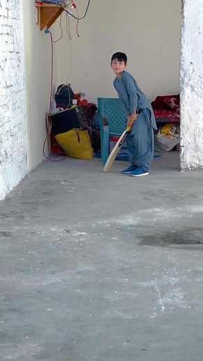 Cricket Bat Swinging in Traditional Attire
