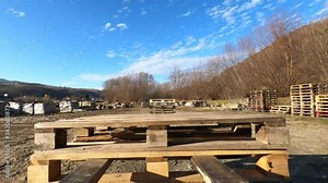 Forklift picking up and stacking pallets
