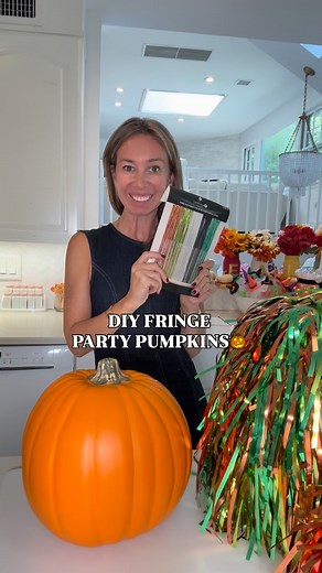 🎃✨ DIY FRINGE PUMPKINS✨🎃 SAVE & SHARE this fun idea for decorating pumpkins!! You know those DIYs that just sparkle the second you make them? This one is it. These Fringe Pumpkins are made entirely out of… wait for it… party door streamers! 🪩🎉 Yes — the same ones you hang in doorways for birthdays or New Year’s Eve parties. With a little packing tape, some layering, and a bit of creative magic, they turn into the most fun, sparkly, glam pumpkins you’ve ever seen. They shimmer in the light, a