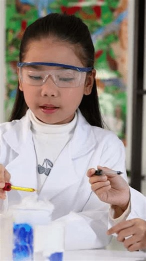clip-4012750367-young-girl-wearing-safety-goggles-uses-pipettes