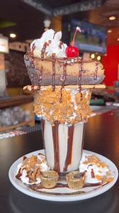 🥜🎉 Peanut butter lovers, rejoice! You guys loved the Smooth Operator so much we decided to keep it on the menu permanently. Feast your eyes on this peanut butter frappe topped with a peanut butter pie, Butterfinger crumble, and Reese's Peanut Butter Cups. | Boston Burger Company