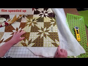 How to trim edges of a quilted quilt and get it ready for binding.