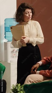 Vertical Video Hospitality manager upselling tourists, suggesting hotel extras and room upgrades, trying to accommodate any special request. Guests discussing booking options while being checked in