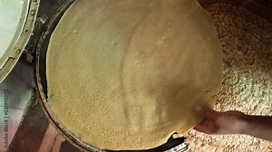 Cooking process of the traditional Ethiopian injera bread, Ethiopia