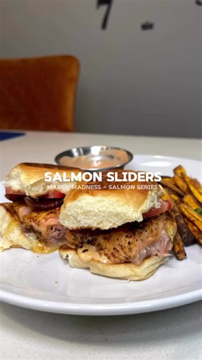 Salmon sliders with sweet potato fries 🔗 Full Ingredient list is available on my Walmart storefront under “Salmon Sliders” - link in bio 🔗 These were so good, here’s how I made it: Cut up sweet potato into thin slices as evenly as possible. Coat them with olive oil, smoked paprika, garlic powder, salt, pepper, and cayenne pepper. Toss and place in air fryer on 380° for 12 mins, I like mine crispy so I keep mine in an additional 2 minutes. Top with fresh parsley. Season salmon with olive oil, O