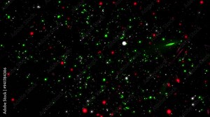 Green and Red Space Particle Lights 4K loop features glitter or particles floating away from the viewer in red and green with lights flashing against a black background in a loop. Stock Video
