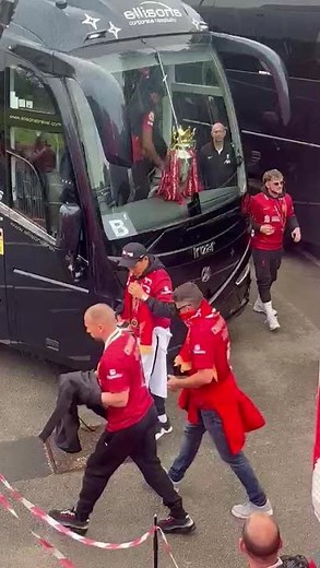 Liverpool FC team board the bus ahead of the parade
