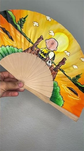 Painting on a hand fan