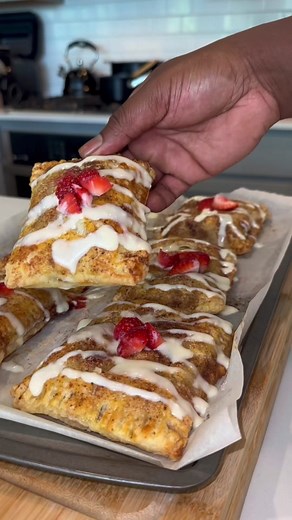 Before school, when you running late bc you ain’t wake up when mama said to wake up… and NOW you running the risk of getting a whooping?… TOP TIER 😮‍💨🔥🔥 Grown Up Strawberry Turnovers GRAB THE COOKBOOK “KITCHEN CULTURE” at the link below this video while ya can! Ingredients 1 pack Pepperidge Farms Pastry Puff 1 lb strawberries, sliced 2 tablespoons Cane sugar Hefty peench brown sugar 3 tablespoons Grand Marnier or orange juice 2 tablespoons cornstarch or flour 1 egg, beaten For the cinnamon s