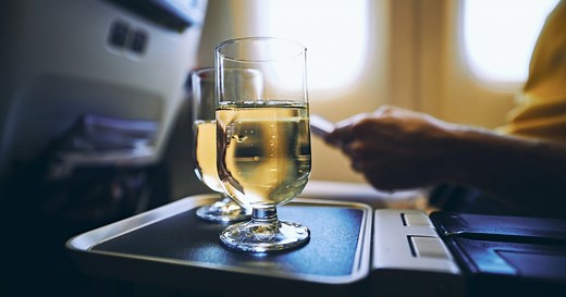 How Alcohol Affects Your Body Differently When You're On A Plane