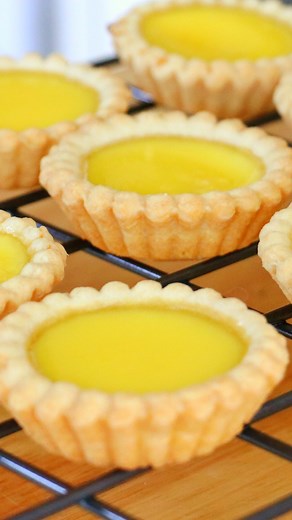 Hong Kong Egg Tarts (Dim Sum Recipe)! 📝 Full Video Printable Recipe: https://cicili.tv/hong-kong-egg-tarts/ Serves: 14 Prep time: 1 hour 15 minutes Rest time: 1 hour 5 minutes Cook time: 20 minutes For the dough: 12 tablespoons (168 g) butter, room temperature 4 tablespoons powdered sugar 1 large egg 2 cups (240 g) all-purpose flour For the filling: 1 cup (240 g) hot water 6 tablespoons white sugar ½ cup (126 g) evaporated milk 4 large eggs 1 teaspoon vanilla extract 📒 Purchase CiCi’s Cookbook