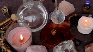 female hand holding and using glass ball crystal ball, pendulum swings over astrologer's table, Harmony with meditation, self-discovery, Spiritual Energy and Balance, divination and fortune-telling
