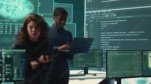 Group of governmental hackers analyzing digital threats on pc networks, using a big screen. Specialists working on collecting information, fighting against cybercrime and cyberterrorism. Camera A.