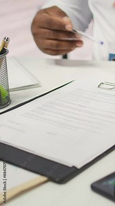 Vertical Video Elderly people in a modern office setting meeting with financial advisor, discussing retirement plans and covering pension options or investments. Securing their life savings. Camera B.