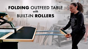 Folding outfeed table with built-in extension rollers