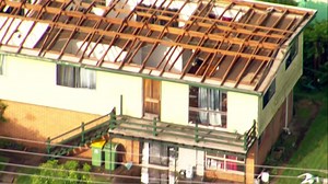 Supercell storm tears off roofs, downs trees and cuts power across Brisbane and Logan