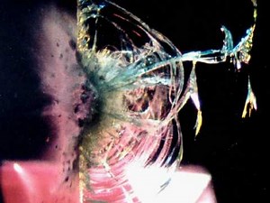 slow motion Bullet hitting Glass filmed at 125,000 frames per second with a Cordin Model 140 camera