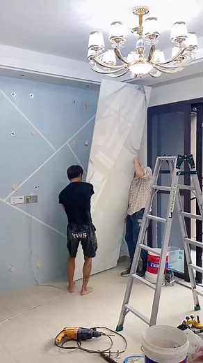 Background wall installation process. #interiordesign #wallpanelling #backdropdecoration #walldecor #homedecorideas #wallboard #wallboards #wallpaper #decorationdesign #decorationboards #decoration_ideas #walldecoration #decoration #decor #deco #wallpanelling #homeimprovement #renovation | Harmercoverings