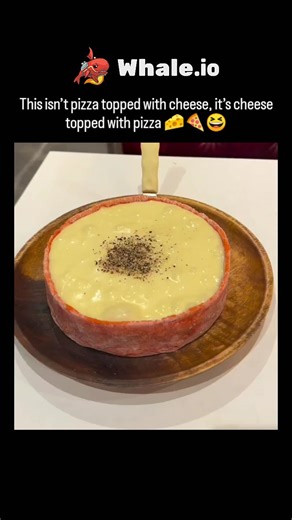 Zahan on Instagram: "The video depicts a massive baked Camembert cheese wheel, sliced with a pizza cutter into wedges, playing on the caption's pun to showcase its gooey, indulgent texture as a viral food hack. - Posted by @comfoodx, a repost curator of appetizing dishes, it exploded to 1.7 million views in under 24 hours, driven by humorous replies questioning if it's "real pizza" or just excessive cheese. - Rooted in French cuisine, baked Camembert offers 85g fat per 100g serving per USDA data