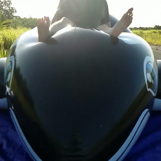 Riding the Inflatable World 5-Meter Black Whale