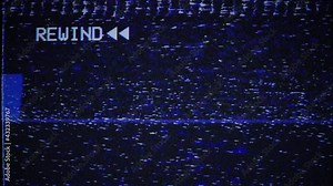 Rewind sign, arrows marks, VHS noise texture. Static noise, glitch effect. Videocassette recorder. Damaged cassette type, bad signal. TV noise. Retro, vintage 90s style animation. Seamless loop 4K