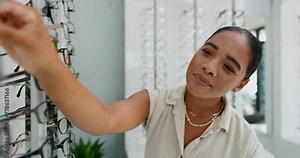 Woman, glasses or choice in vision, optometrist or retail as customer, thinking or search for stock. Optician, sales assistant or eyewear as happy, decision or idea of inventory in specialist service