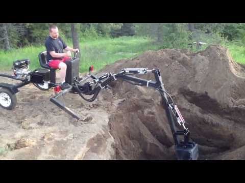 Digging the Pond with the towable backhoe