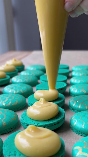 Passion Fruit Macarons with Painted Macaron Shells 🧜‍♀️ Passion fruit ganache is one of my all time favorite macaron fillings— especially for summertime! Check out my entire receipe and video tutorial in my new ebook macaron course! #macarons #frenchmacarons #pastryvideos #recipes #ebook