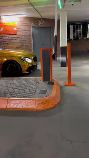 Bright Yellow Car Showcase in Indoor Parking Garage