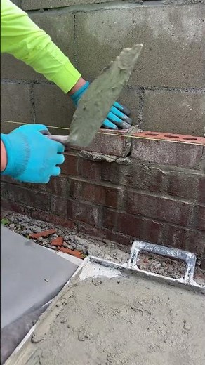 Building a cinder block wall with brick and concrete!