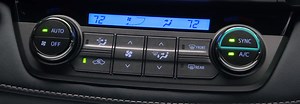 What do the dual-zone automatic climate control buttons mean in the Toyota RAV4?