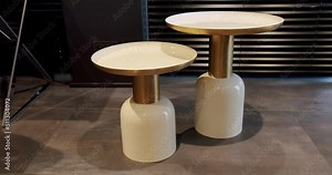 Details in Home luxury decor and Loft cozy apartment. Modern Minimalist Round coffee Table in Contemporary Interior in living room. Luxury details with Gold material modern round table in living room.
