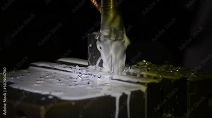 Industrial metalworking cutting automation process by milling CNC.Micro machining process , Coolant and lubrication.Close up of CNC machine at work.