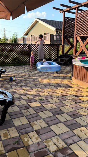 Toddler's Delightful Pool Playtime on a Sunny Day