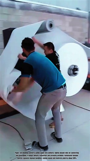 Paper Roll Winding Operator controls tension to wind jumbo rolls for output