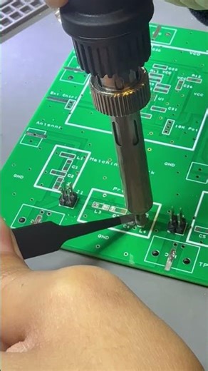 Using a hot air pencil to remove an SMT component