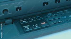 Control buttons of an advanced 6-head VCR where the sound is recorded in Hi-Fi quality and you can adjust the recording level of each channel separately. Closeup. Macro. Shot in motion