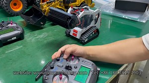 The test video for the sweeper works in our customized 1/14 RC hydraulic skid loader👍 #rchobby #rc #rcloader | Toucanhobby