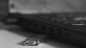 clip-1102548907-data-transfer-flash-drive-plugged-into-usb