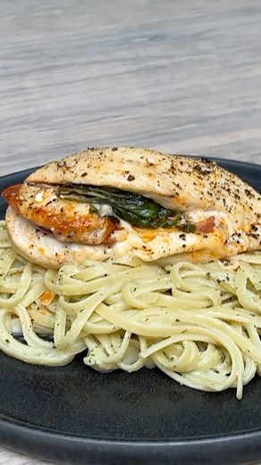 This basil, mozzarella and chorizo stuffed chicken with creamy pesto pasta is one of my most viewed video recipes ever on Instagram 😲 I cooked it in the oven on 180 degrees for 30 mins and it came out perfectly 👌 The pasta I threw in a spoonful of pesto and cream cheese at the end. This recipe is insane. Would you try this one at home? 😜 | The Body Coach