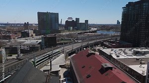 REM subway train in Montreal city drone following electric public infrastructure transportation driving around modern smart city