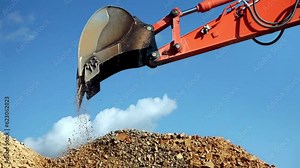excavator landscape working Dump Truck Digging Limestone On Road construction site.